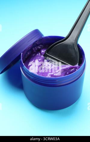 Hair brush and cosmetics on light background Stock Photo - Alamy