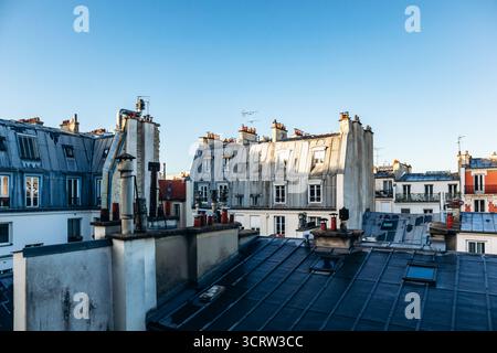 Classic Paris rooftops with chimneys and mansard windows Stock Photo ...