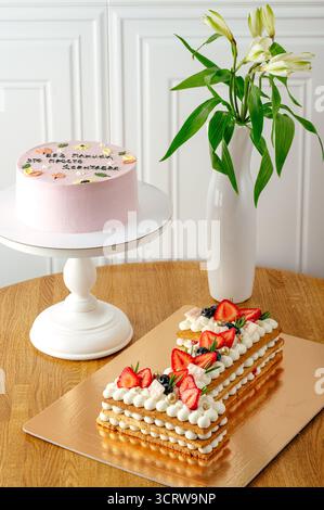 Plastic lunch box with tasty bento cake on turquoise background Stock ...