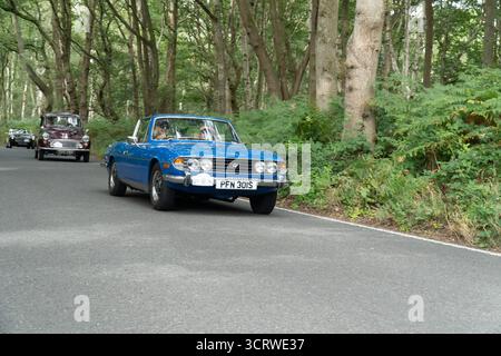 Triumph Stag sports car convertible Classic Car driving in country lane ...