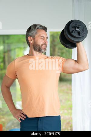 Handsome millennial Latin male at the train station hailing a ride ...
