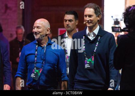 Amazon founder Jeff Bezos, right, speaks with Miami Mayor Francis ...