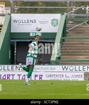 Yeovil, UK. 04th Oct, 2025. Boreham Wood's Tom White passes ball as he ...