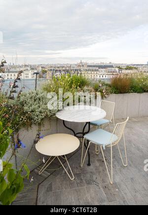 A view of the marble table and chairs in a garden on a sunny day Stock ...