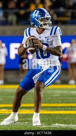 Duke quarterback Darian Mensah (10) spins away from Virginia's Landon ...
