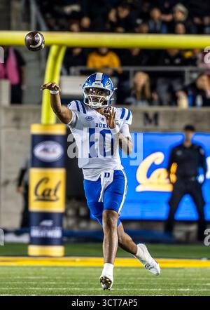 Duke quarterback Darian Mensah (10) spins away from Virginia's Landon ...