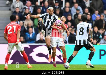 Joelinton Of Newcastle United battles with Morgan Rogers Of Aston Villa ...