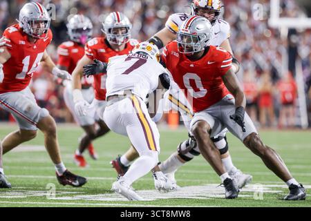 Minnesota running back Fame Ijeboi (7) is tackled by Iowa linebacker ...
