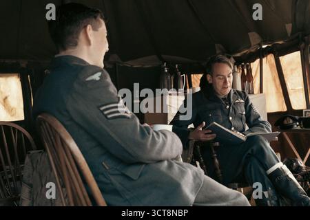 RAF aircrew in vintage aircraft cockpit during wartime reenactment at ...