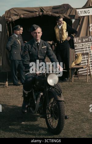 RAF sergeant in wartime uniform with vintage motorcycle at military ...