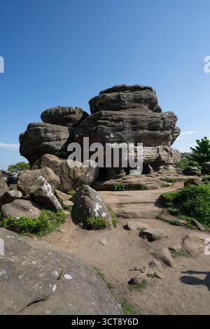 Millstone grit weathered gritstone formation silhouetted against the ...