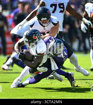 Houston Texans running back British Brooks, left, hugs New England ...