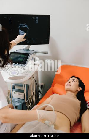Ultrasound machine shows detailed internal imaging on screen. The ...