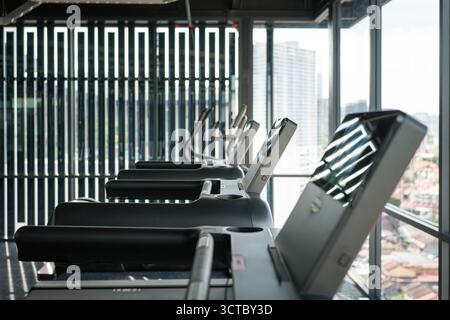 Treadmills machine inside a gymnasium Stock Photo - Alamy
