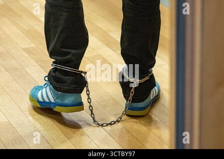 Regensburg, Germany. 06th Oct, 2025. The defendant enters the courtroom ...