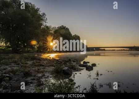 A beautiful sunrise paints the sky over Tangdao Bay in Qingdao City ...