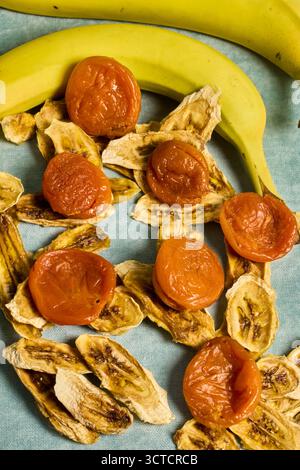 Top view of fresh apricots on a bowl isolated on light pink background ...