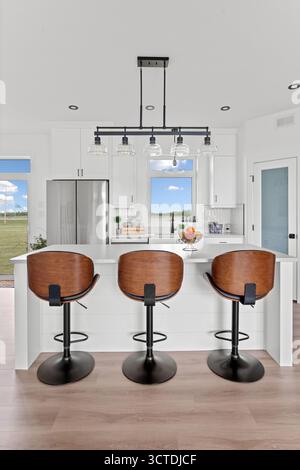 White counter with stove placed in stylish light kitchen with white ...