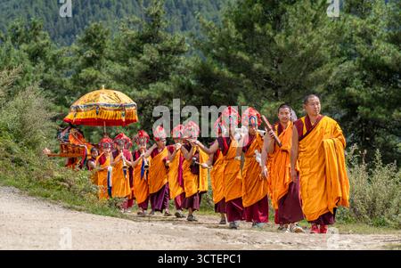 Phobjikha, Bhutan - 21 September 2025: View of monks processing along a ...