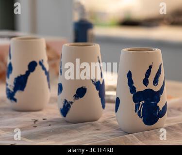 Kids craft. Painted blue and decorated with jewels and feathers paper ...