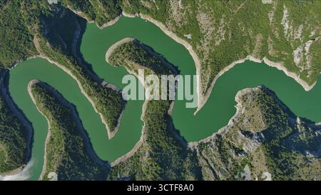 Aerial top view of curved meanders in canyon of Uvac river, Serbia ...