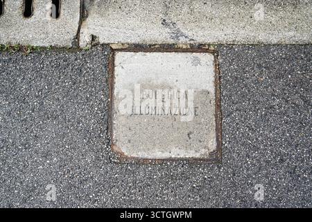 Street lighting manhole cover in Los Angeles. High voltage electricity ...