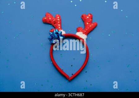 Beautiful Christmas headband and confetti on light background with ...