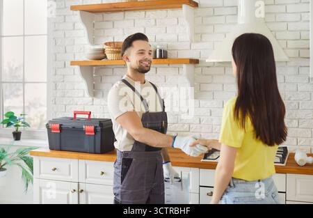 Plumber service, professional worker, female client deal hand shake ...