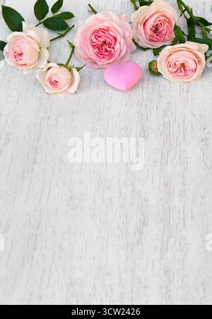 Happy woman's day. March 8. Roses, teddy bear and chalkboard on a white ...