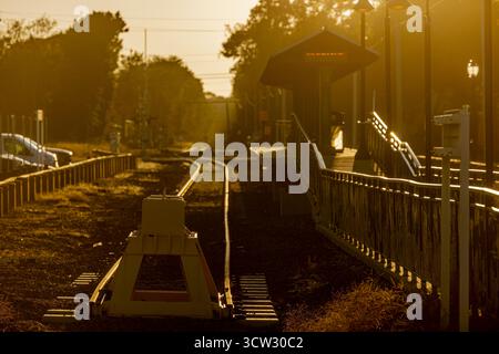 late day sun on the greenport, ny train station and lirr tracks Stock ...