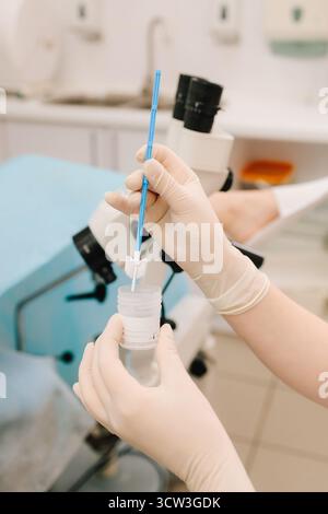 Gynecologist collects a Pap smear sample for cervical screening ...