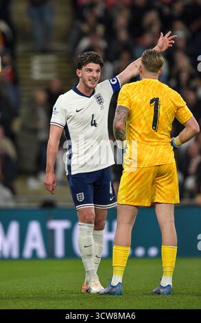 Declan Rice and Jordon Pickford of England in action during the ...