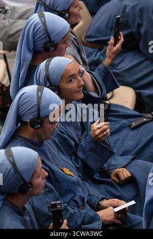 Nuns wait for the arrival of Pope Leo XIV at Pavia's Cathedral ...
