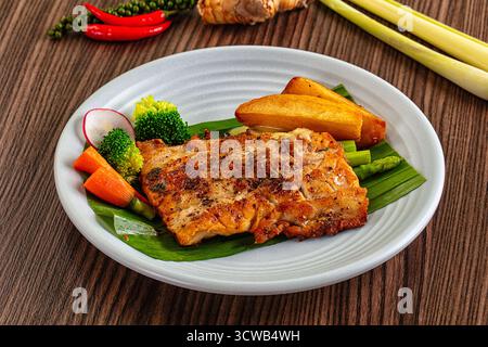 Gourmet asian Grilled crocodile steak served potato and asparagus Stock ...