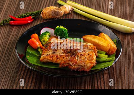 Gourmet asian Grilled crocodile steak served potato and asparagus Stock ...