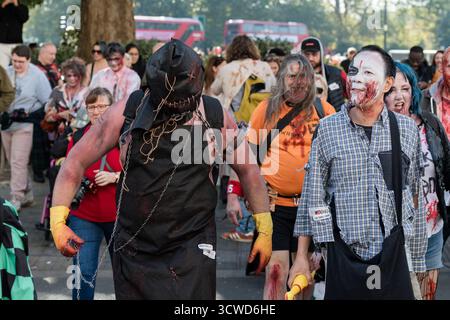 People dressed as zombies march during a demonstration and general ...