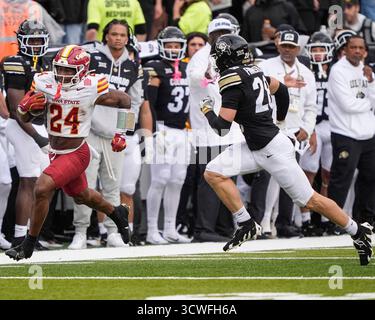 Iowa State running back Abu Sama III (24) tries to escape Arkansas ...