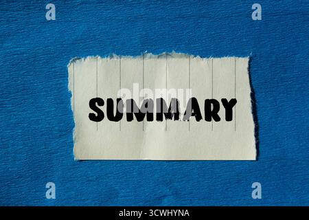 Summary message written on ripped torn paper background. Conceptual ...