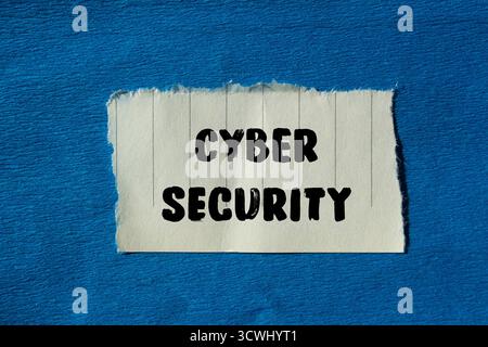 Cyber security message written on ripped yellow torn paper with gray ...
