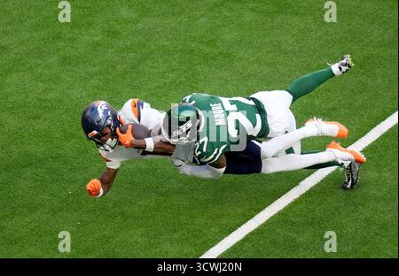 New York Jets' Malachi Moore (27) celebrates with teammate Tony Adams ...
