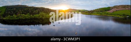 Aerial view of Ladybower Reservoir with scenic countryside and blue sky ...