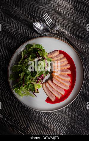 Roasted duck cut into pieces on a plate Stock Photo - Alamy
