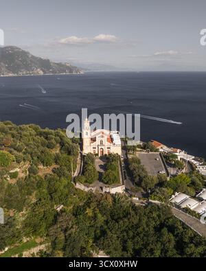 Perched atop a lush hillside overlooking the azure waters of Mirissa ...