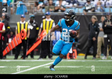 Carolina Panthers running back Trevor Etienne (23) avoids a tackle from ...