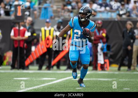 Carolina Panthers running back Trevor Etienne (23) avoids a tackle from ...
