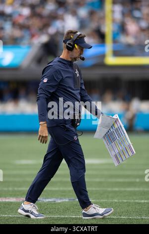 Dallas Cowboys head coach Brian Schottenheimer wears a tribute t-shirt ...