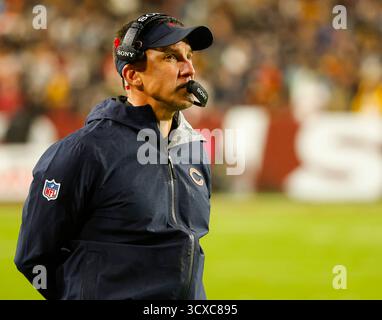 Chicago Bears head coach Ben Johnson smiles as he talks to media at a ...