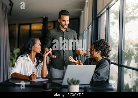 Business colleagues having a misunderstanding and arguing during a ...