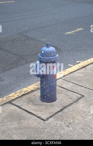 Street scene with decorated fire hydrant in the old medieval city of ...