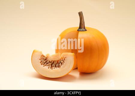 Ripe pumpkin on beige background Stock Photo - Alamy
